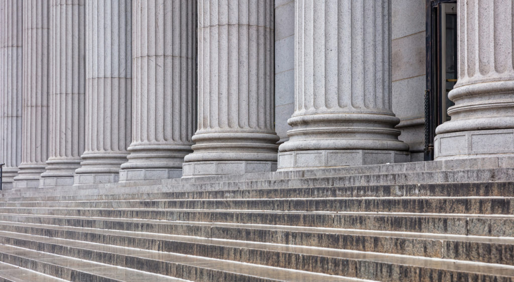 Stone pillars row and stairs detail. Classical building facade ...